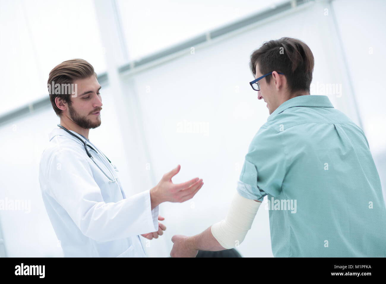 doctor explaining a patient Stock Photo - Alamy