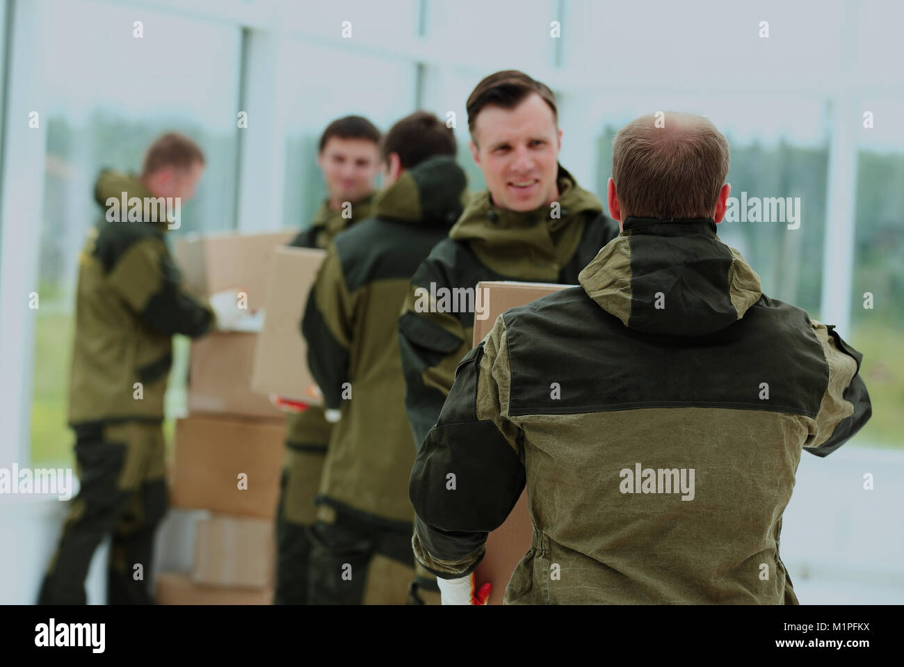 workers unload boxes Stock Photo - Alamy