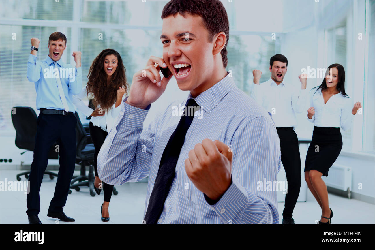 Business team celebrating a triumph with arms up Stock Photo - Alamy