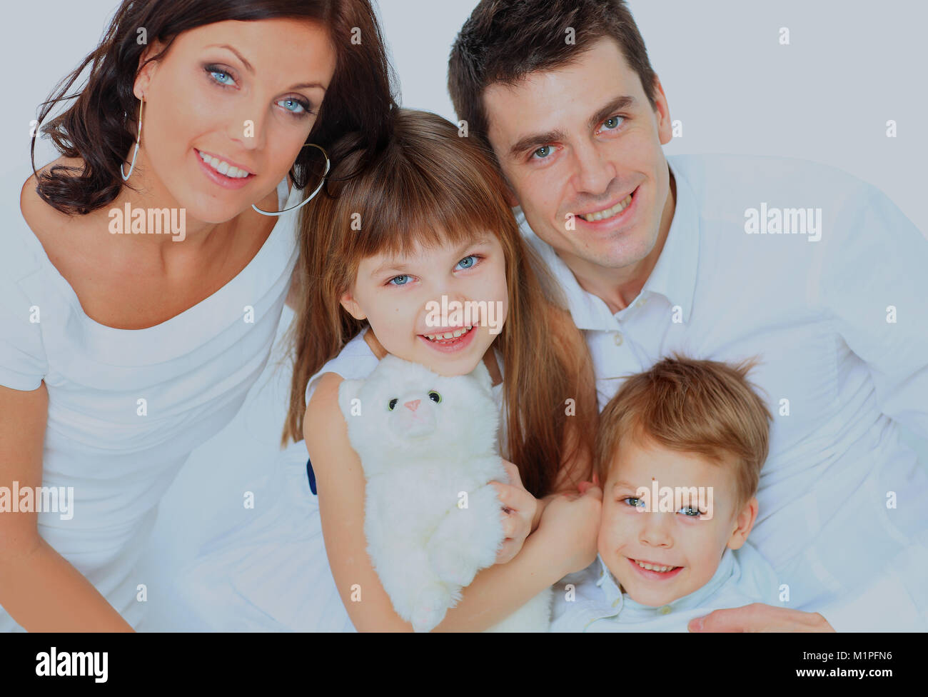 Beautiful happy family - isolated over a white background Stock Photo ...