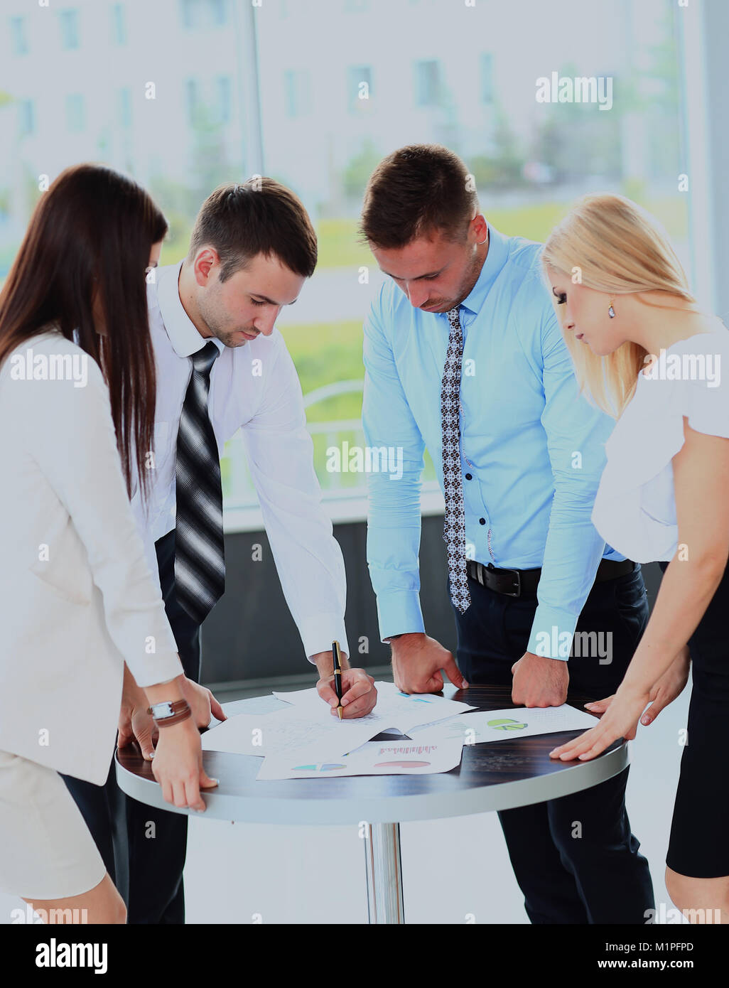 Business meeting - manager discussing work with his colleagues Stock ...
