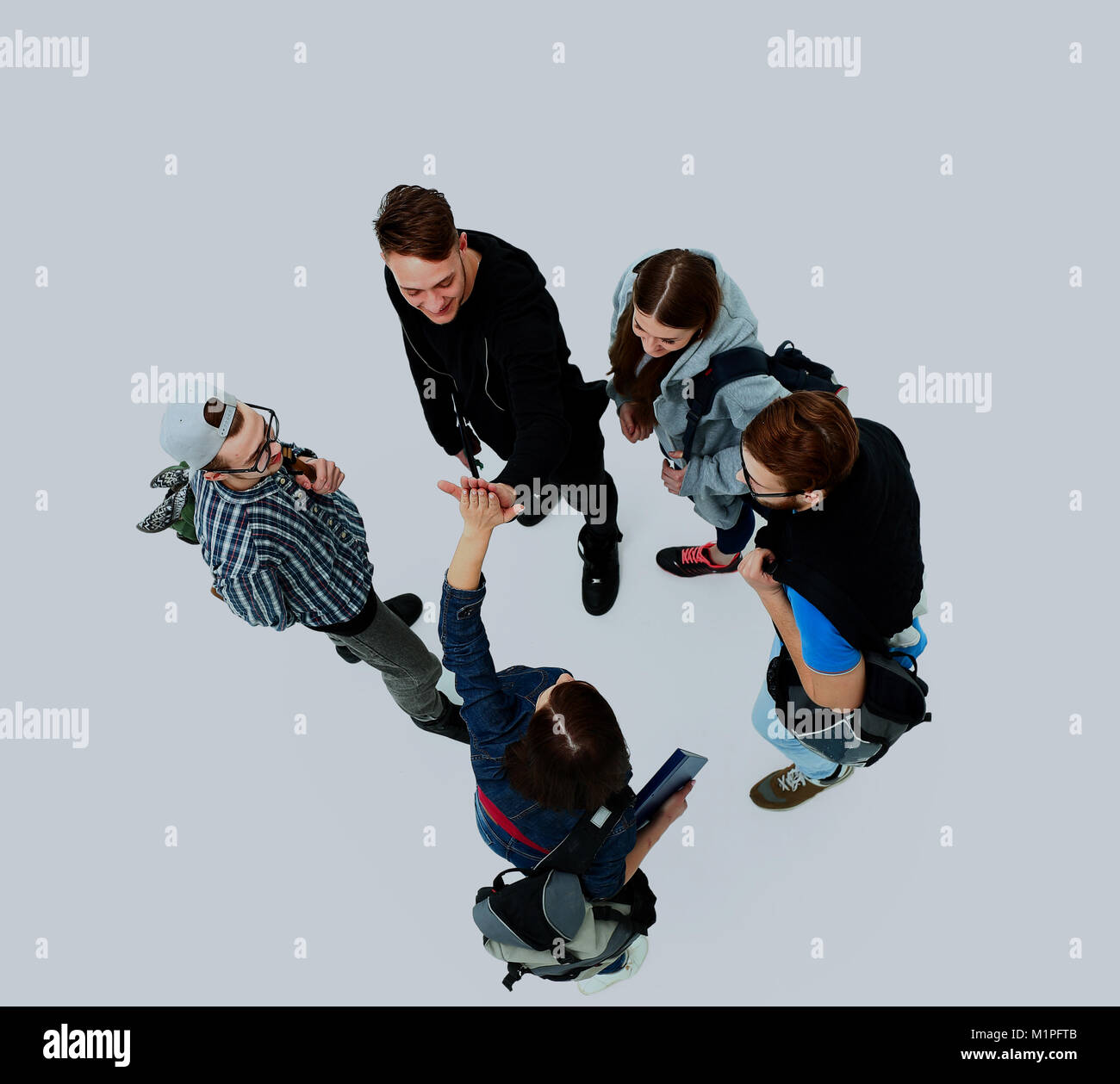 Top view. Happy smiling young group looking at camera Stock Photo - Alamy