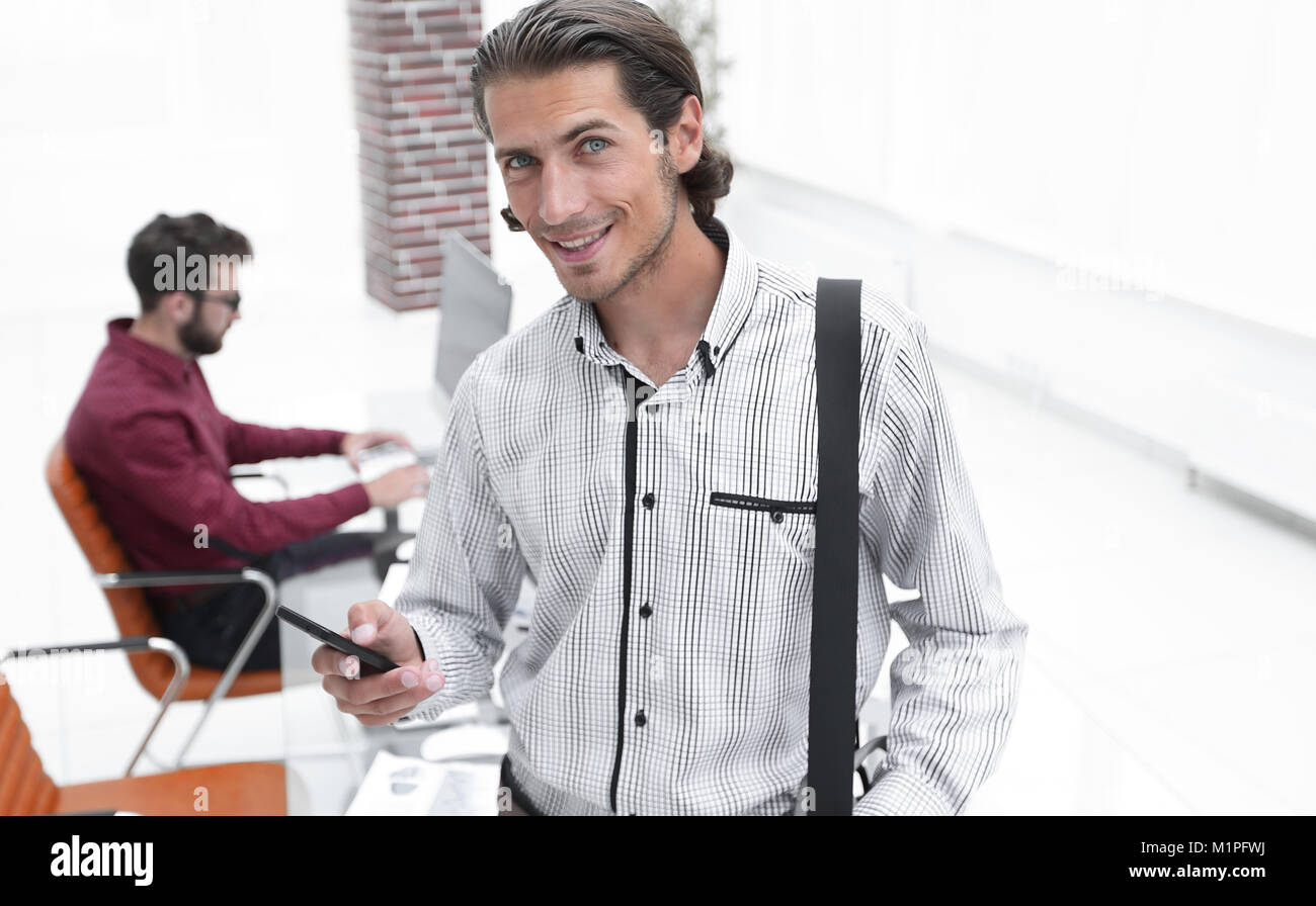 young employee standing in the office Stock Photo - Alamy