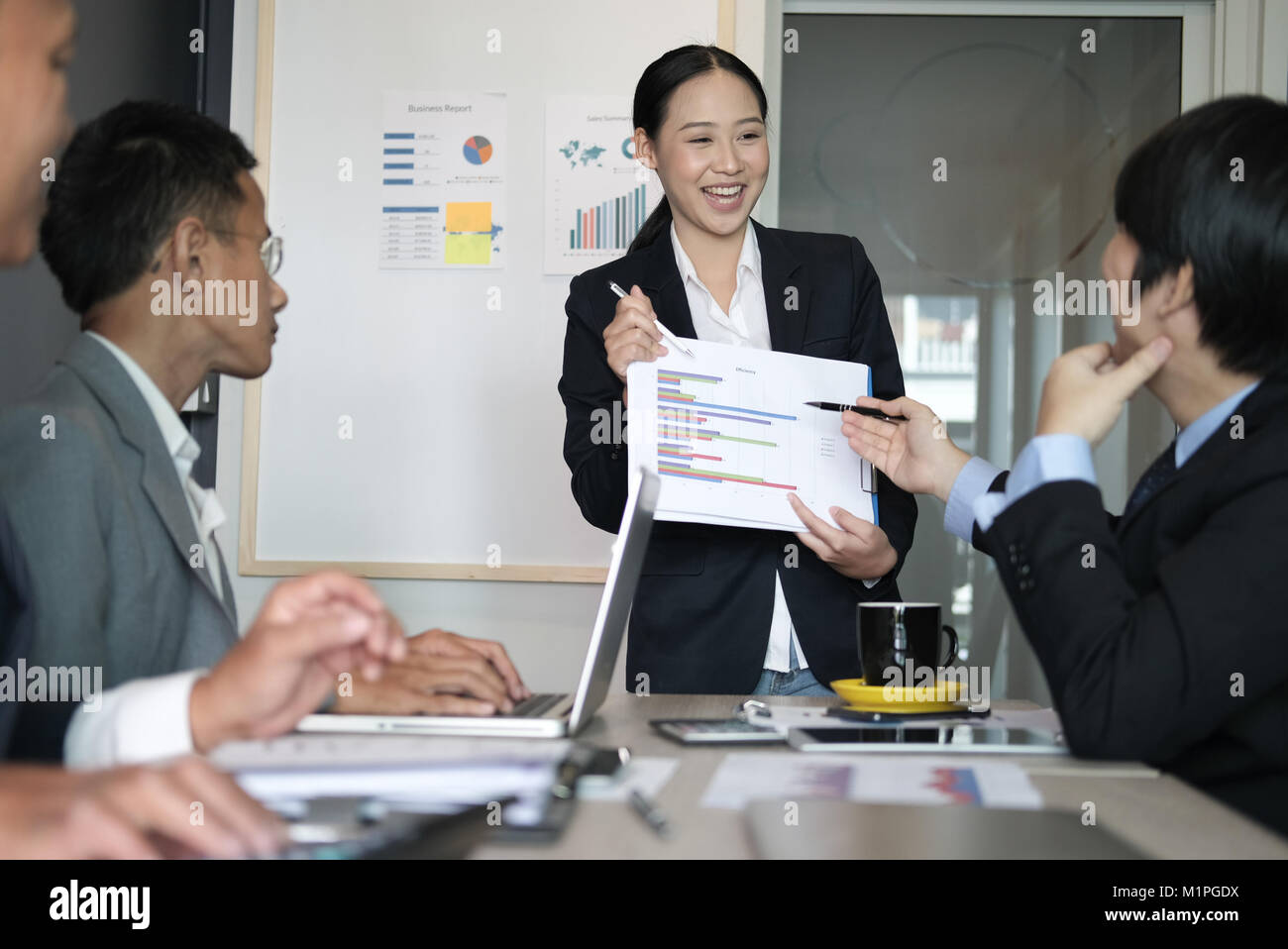 businesswoman present financial plan report to co worker team. woman ...