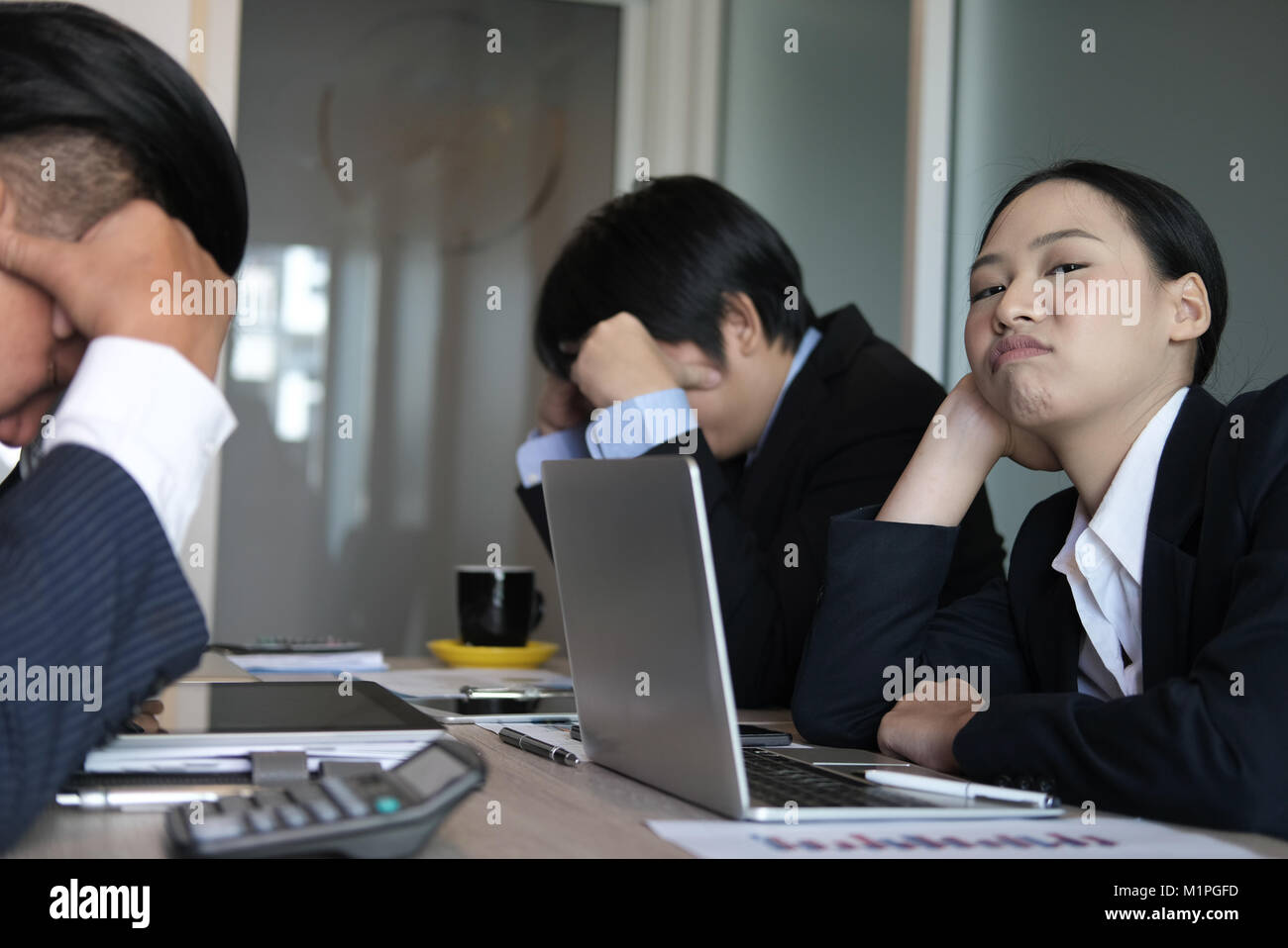 bored businesswoman lean head on hand at meeting. unhappy businessman ...
