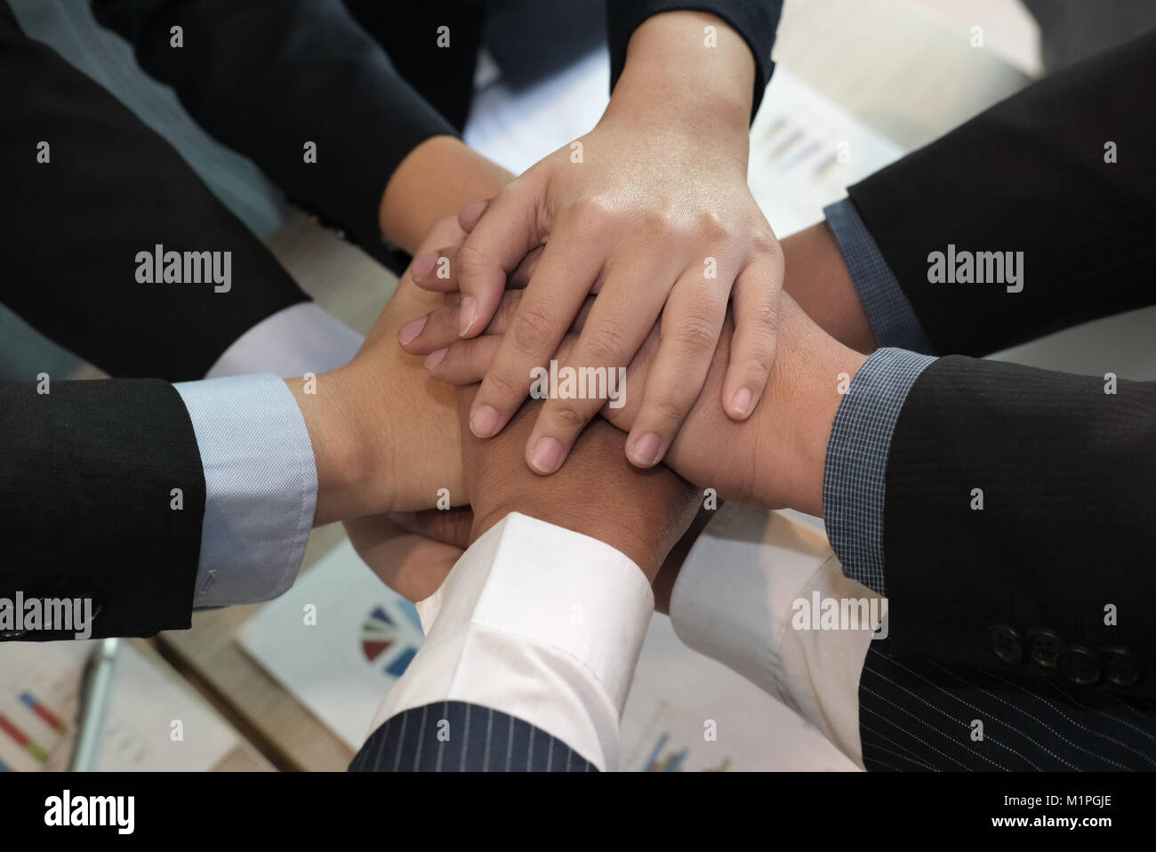 businessman joining united hand, business team touching hands together ...