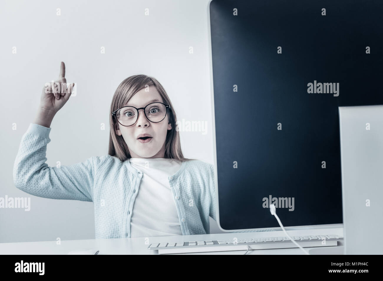 Funny girl getting excited while having good idea Stock Photo - Alamy