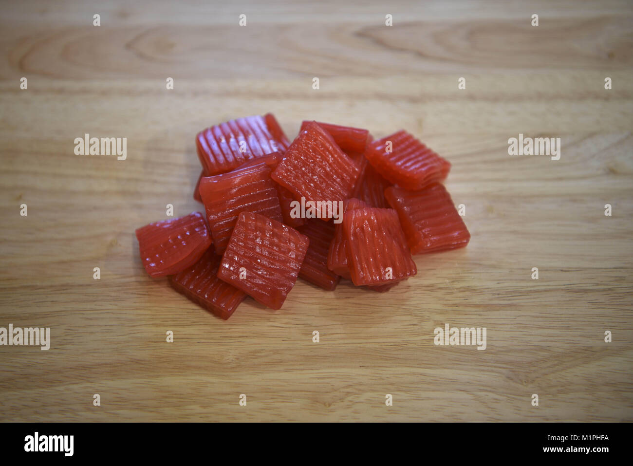 sweets treats or candy of Finnish red square shape shiny liquorice ...