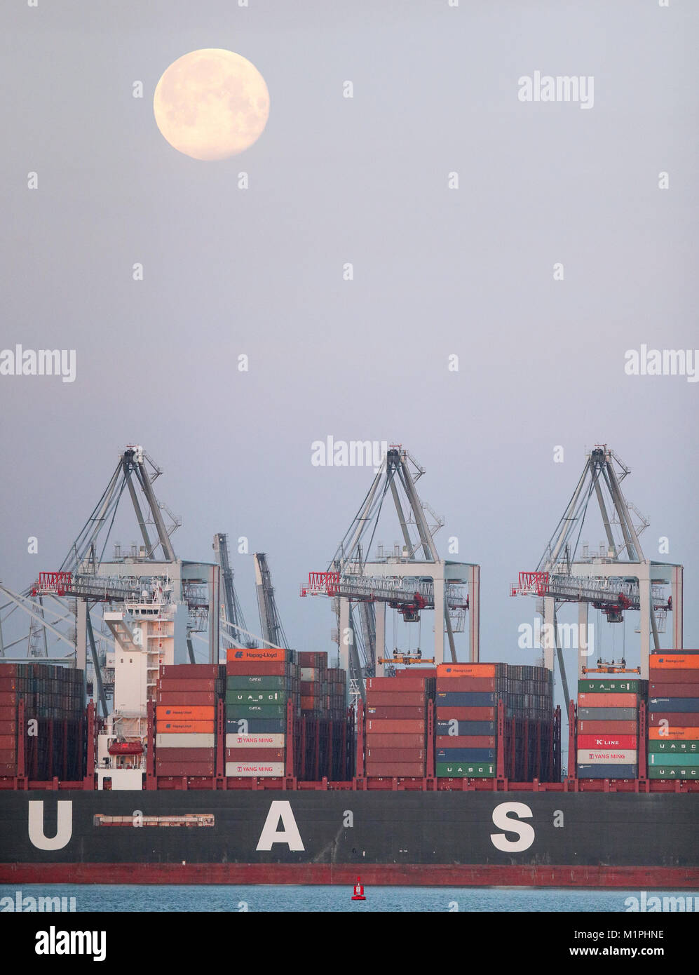 A generic stock photo of the moon over a container ship at Southampton ...