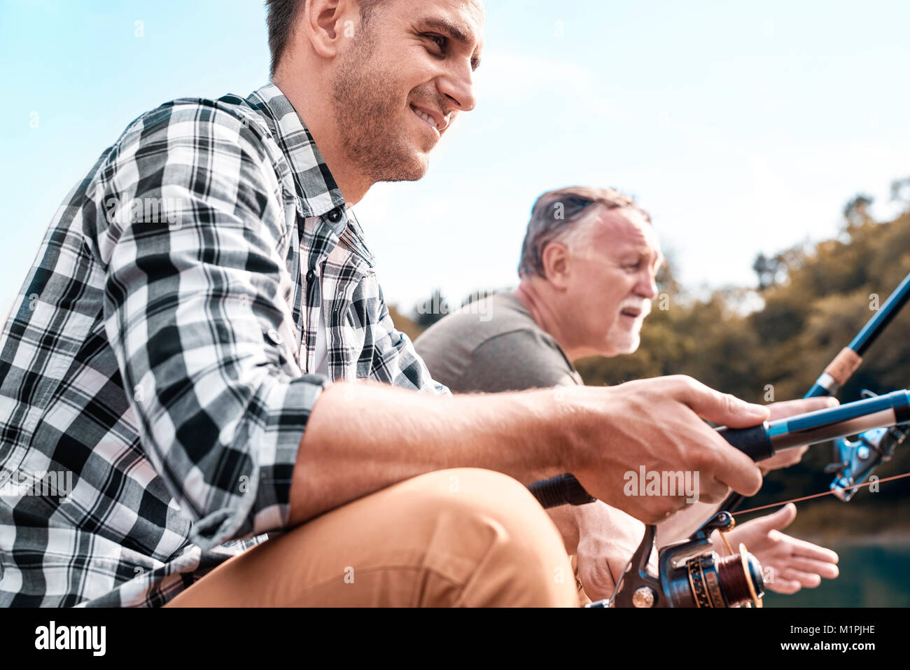 Close up of two men fly fising Stock Photo - Alamy