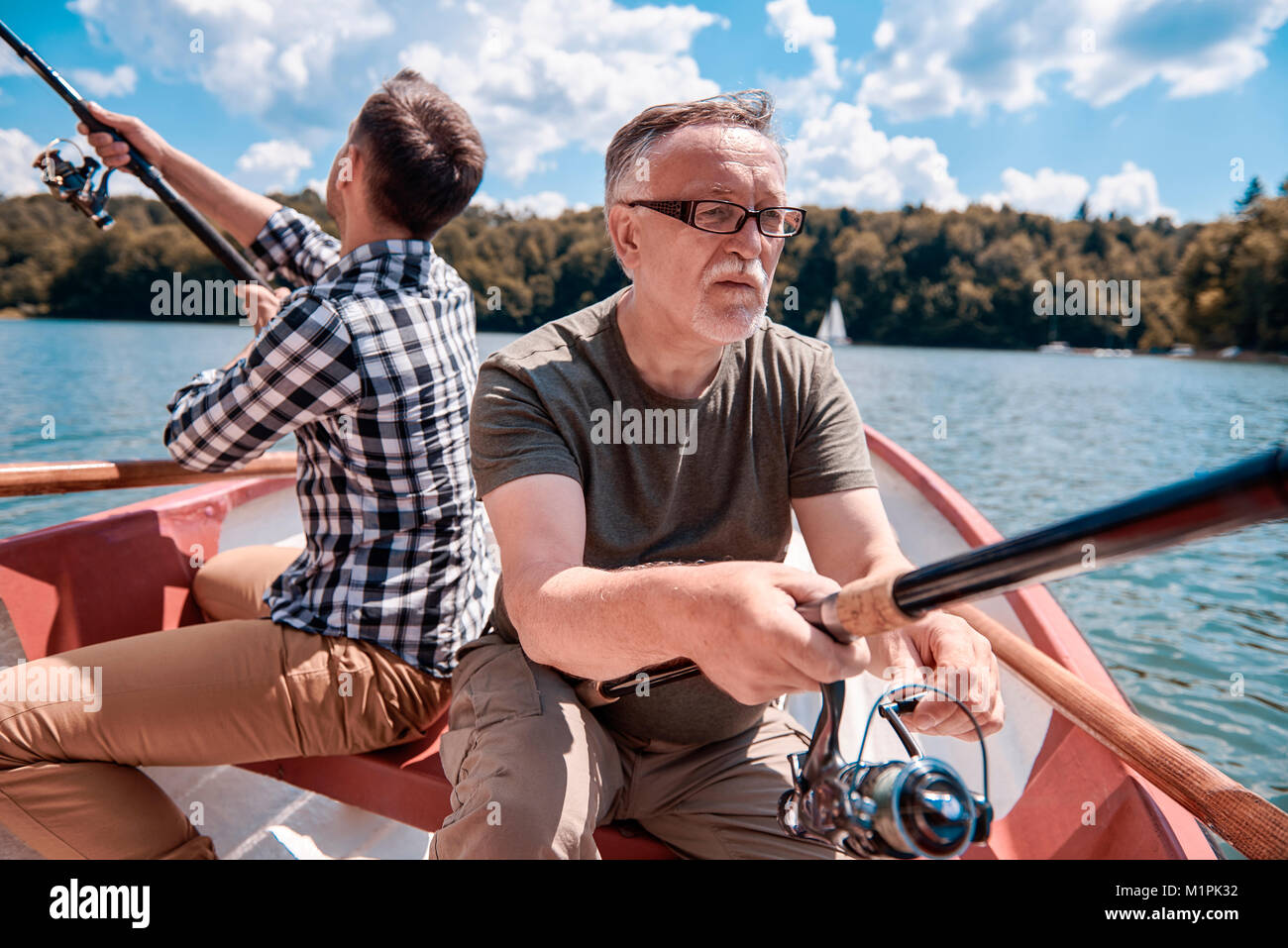 Men waiting for fish and bite Stock Photo - Alamy