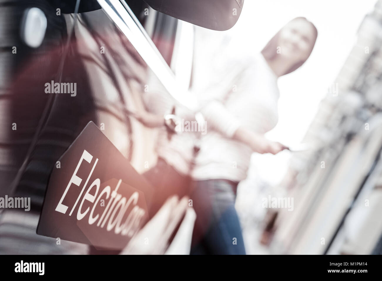 Close up of young woman renting electric car Stock Photo - Alamy Close up of young woman renting electric car Stock Photo - Alamy