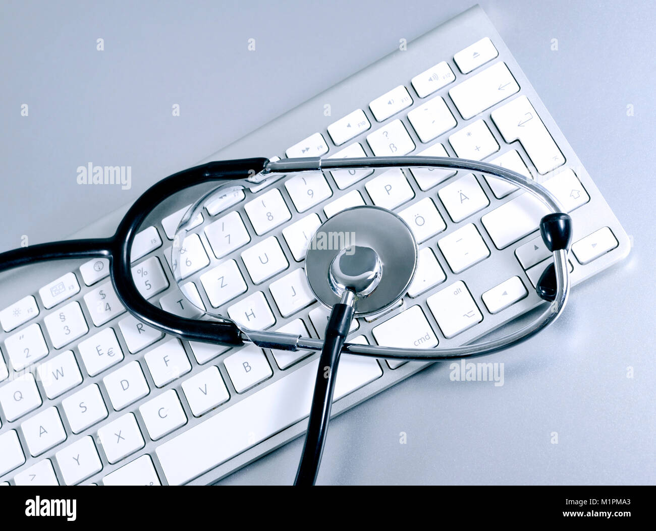 It support scene with stethoscope and computer keypad. Medical ...