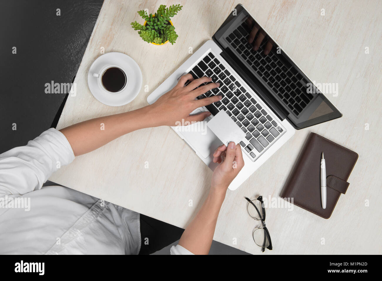 Top view of man using a modern portable computer in home office ...