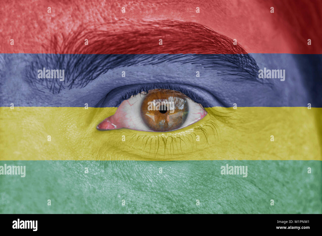 Human face and eye painted with flag of Mauritius Stock Photo - Alamy