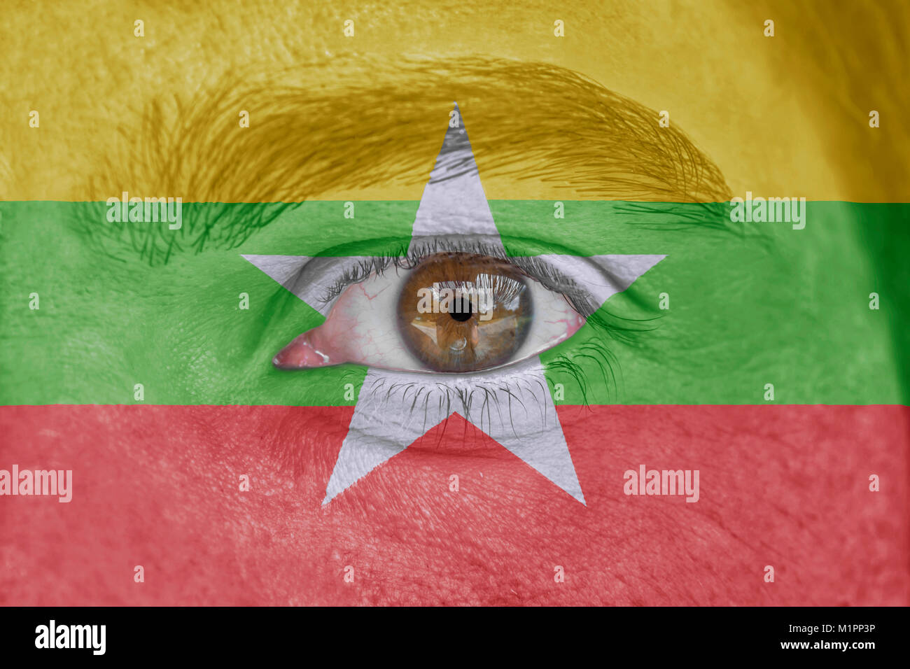 Human face and eye painted with flag of Myanmar Stock Photo - Alamy