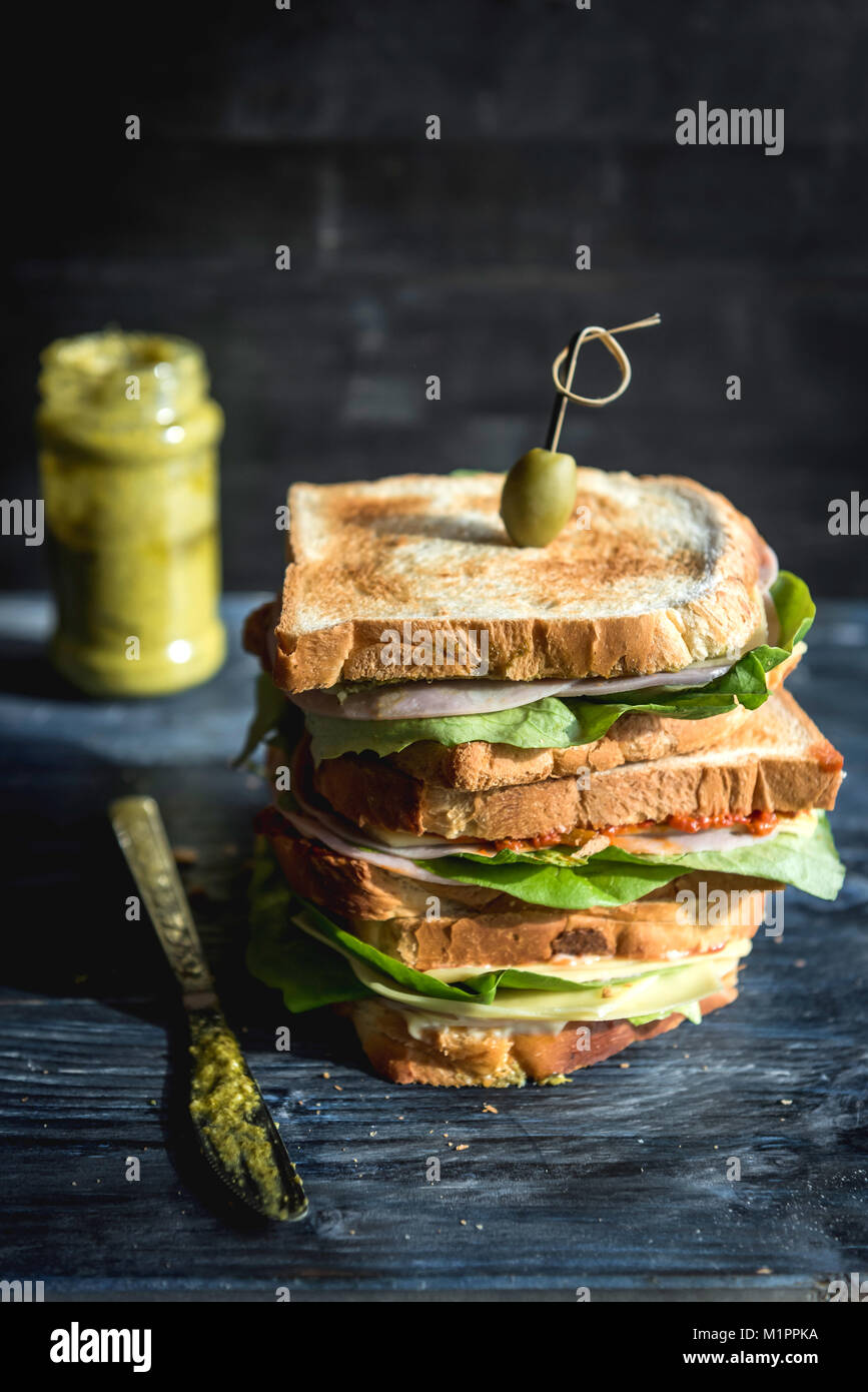 Big toast sandwich with pesto and ham,selective focus Stock Photo - Alamy