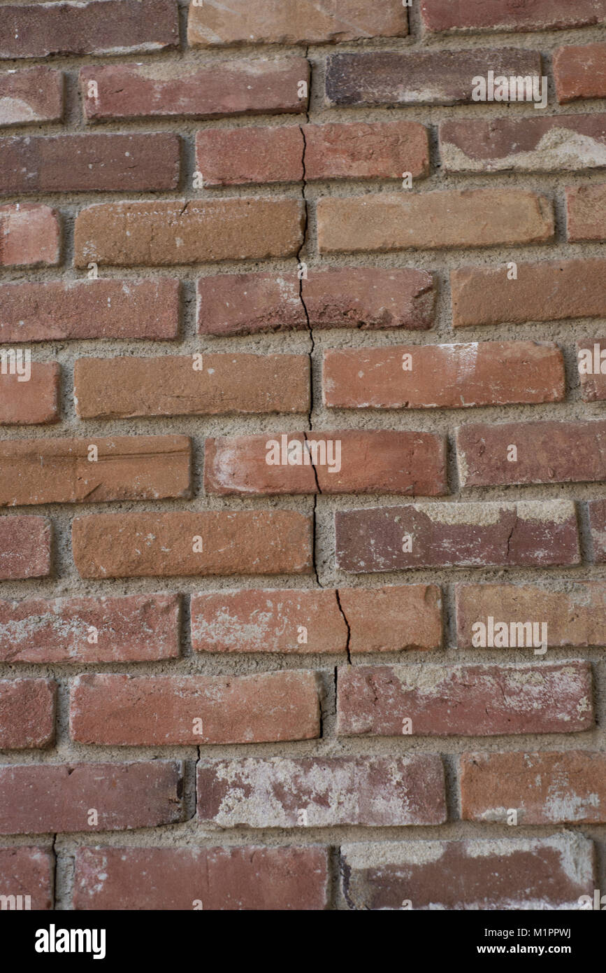 vertical red brick exterior wall with crack Stock Photo - Alamy