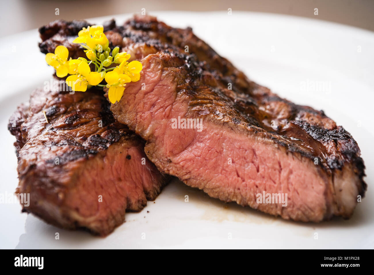 Entrecote with grilled garlic Stock Photo - Alamy