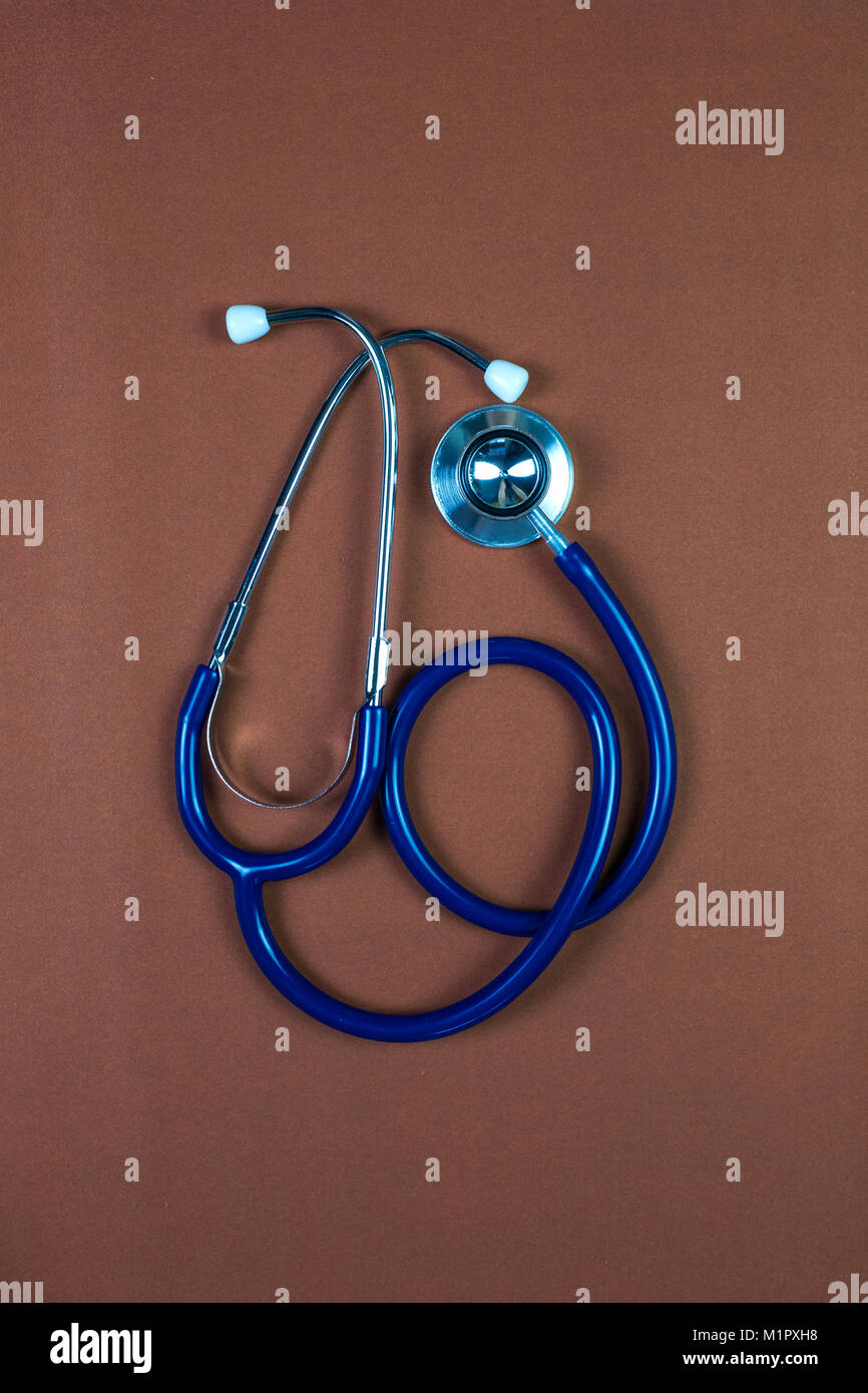Stethoscope with blue tube on table top view with copy space. health ...