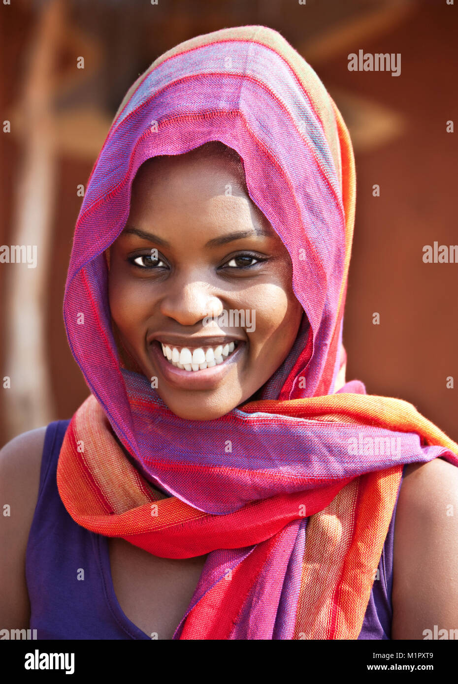African woman in front of the house in the village, Botswana Stock ...