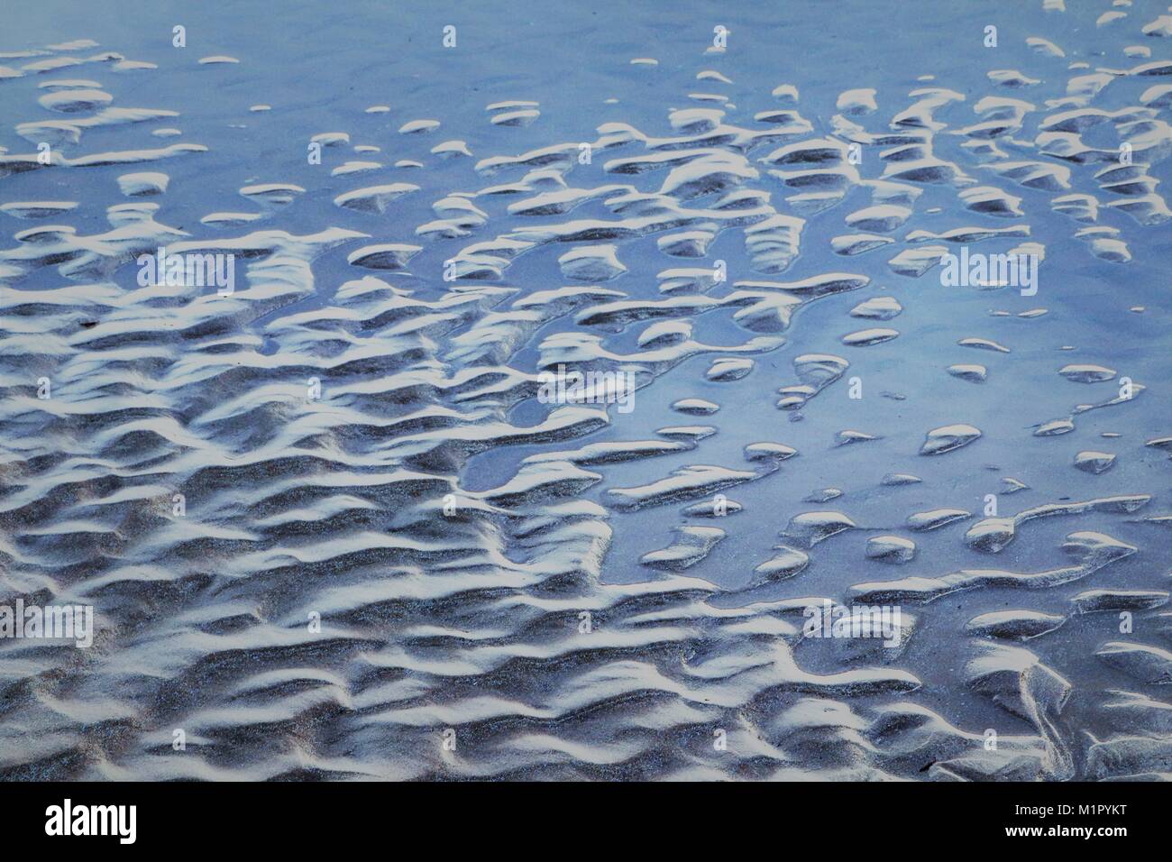 Patterns in sand, multi-coloured Stock Photo - Alamy