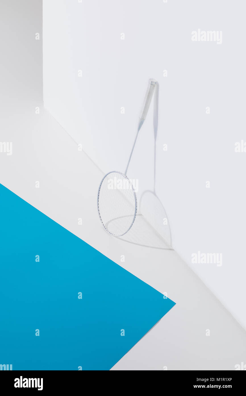 badminton racket at white wall with blue paper near Stock Photo - Alamy