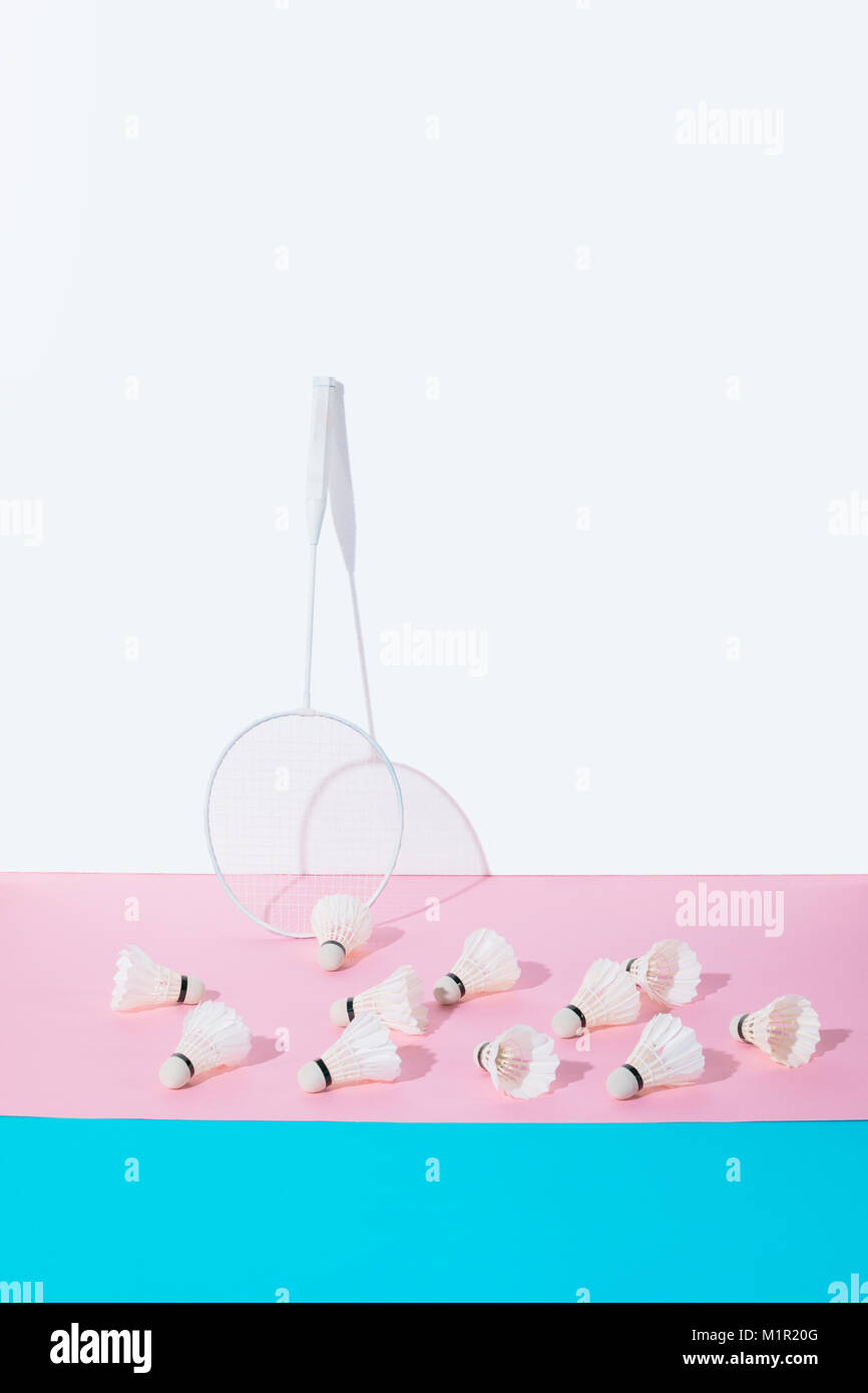 badminton racket and shuttlecocks on blue and pink papers Stock Photo ...