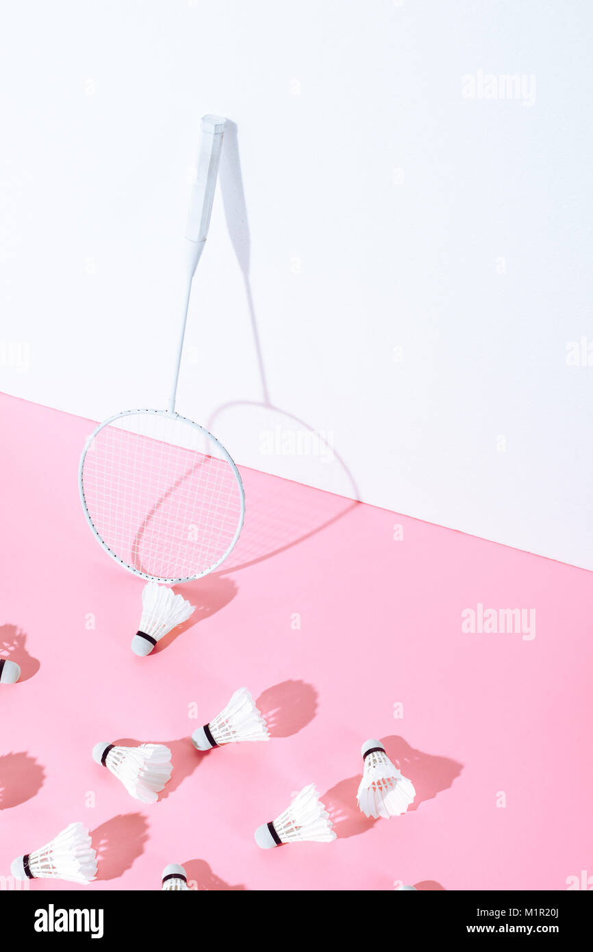 badminton racket and shuttlecocks on pink paper at wall Stock Photo - Alamy
