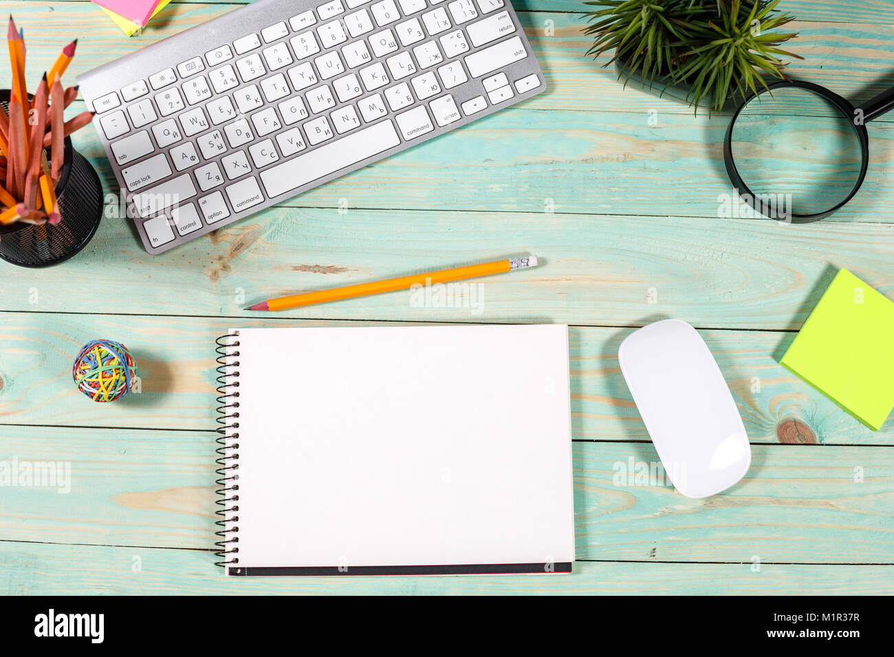 Modern green wooden office desk with laptop computer. Minimal concept ...