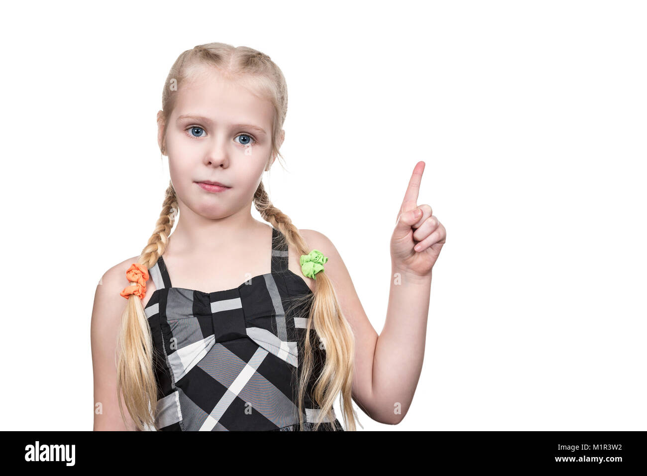 Girl points in the side and up Stock Photo - Alamy