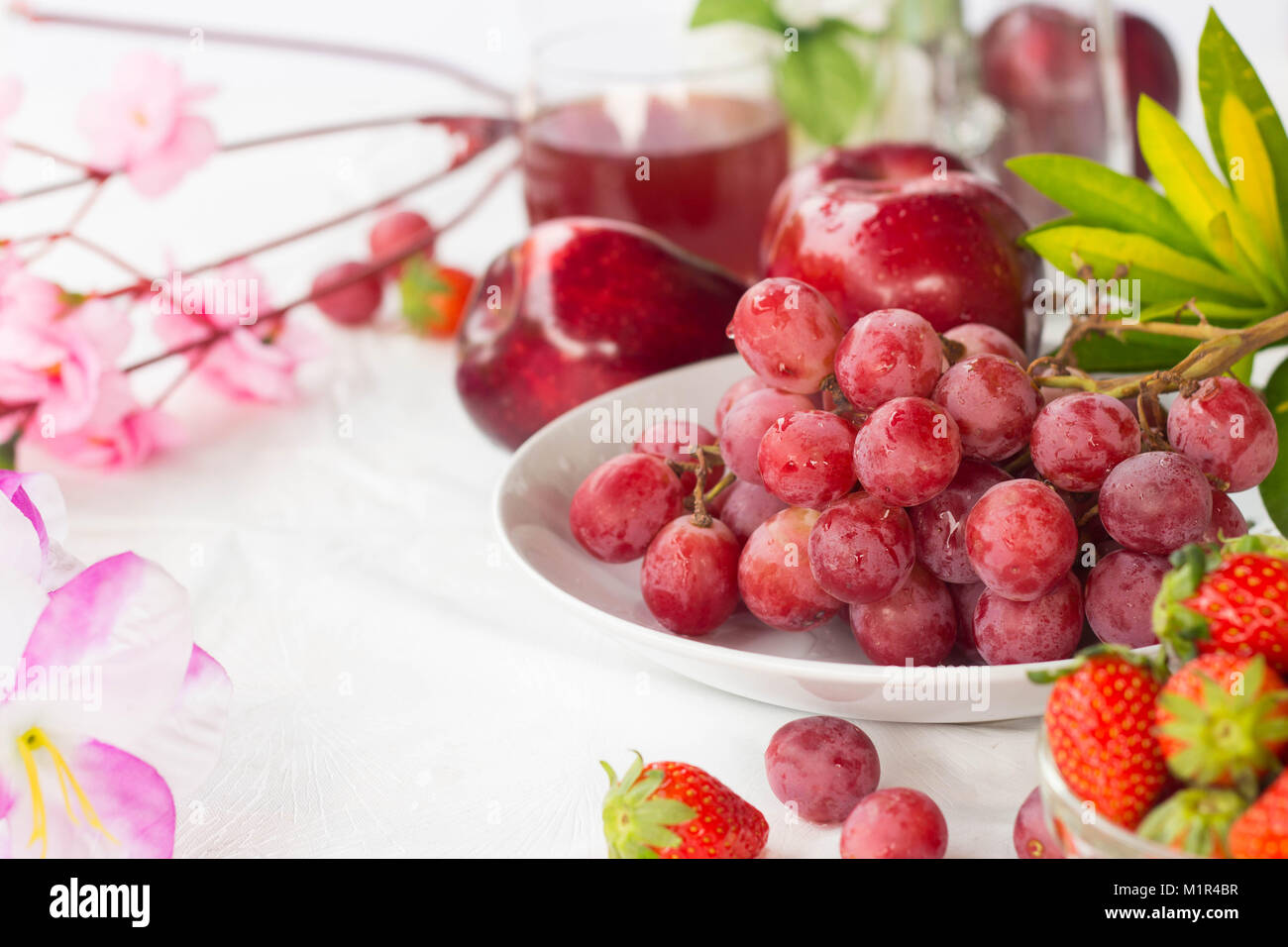 Fresh red fruit mix and juice for healthy from nature Stock Photo - Alamy