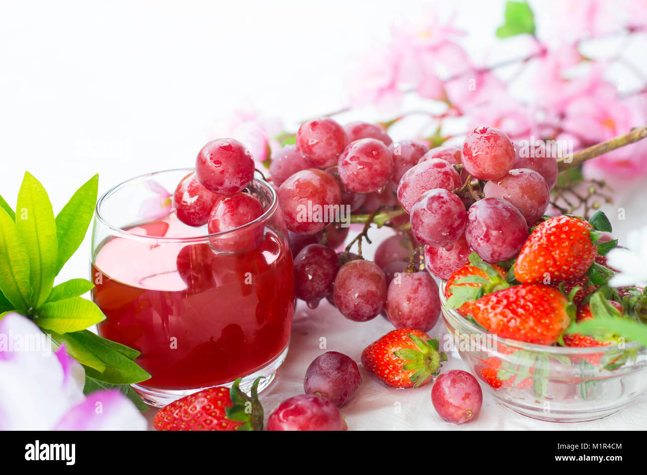 Fresh red fruit mix and juice for healthy from nature Stock Photo - Alamy