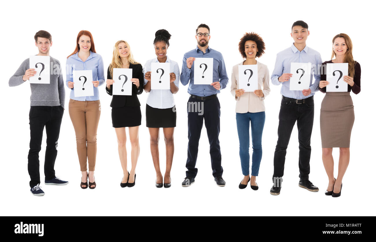 Group Of Happy College Students With Question Mark Sign Standing On ...