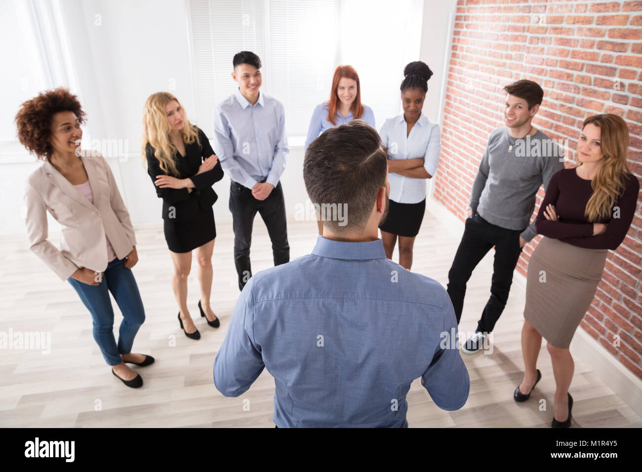 Rear View Of Manager Having Conversation With His Business Colleagues ...