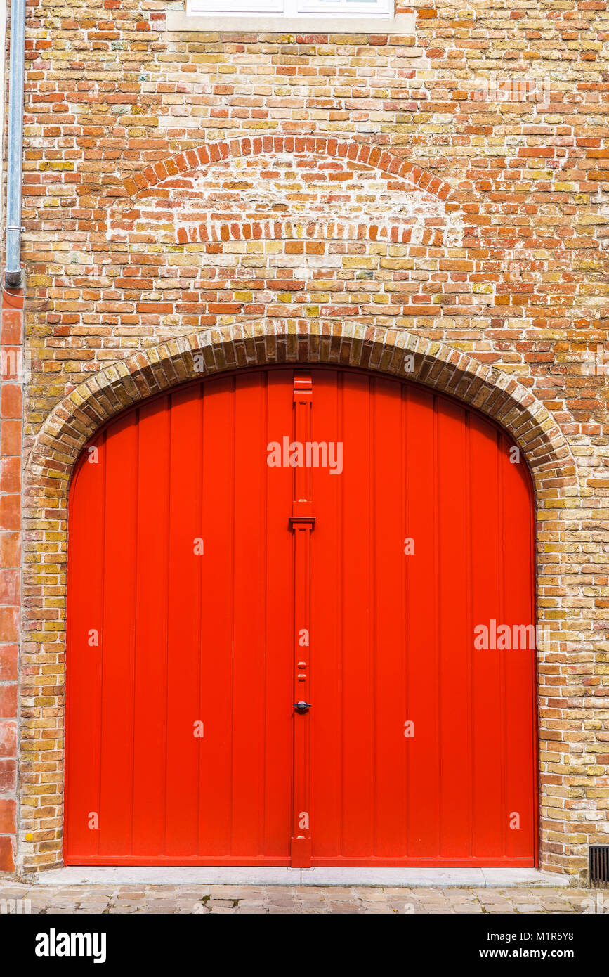 Red door of an old classic building in an old historic center of the ...