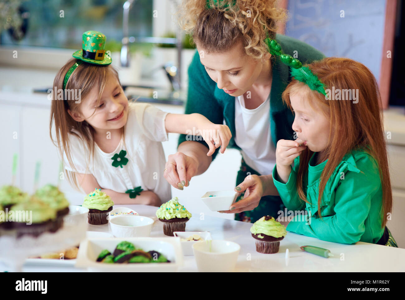 Woman with children decorating cupcakes Stock Photo - Alamy Woman with children decorating cupcakes Stock Photo - Alamy