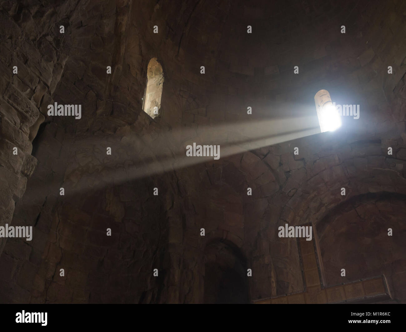 Light flowing in through narrow window slits in the domed tetraconch ...