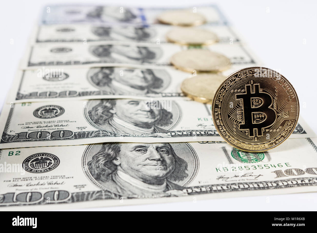 New virtual money Golden bitcoin coin on us dollars background ...