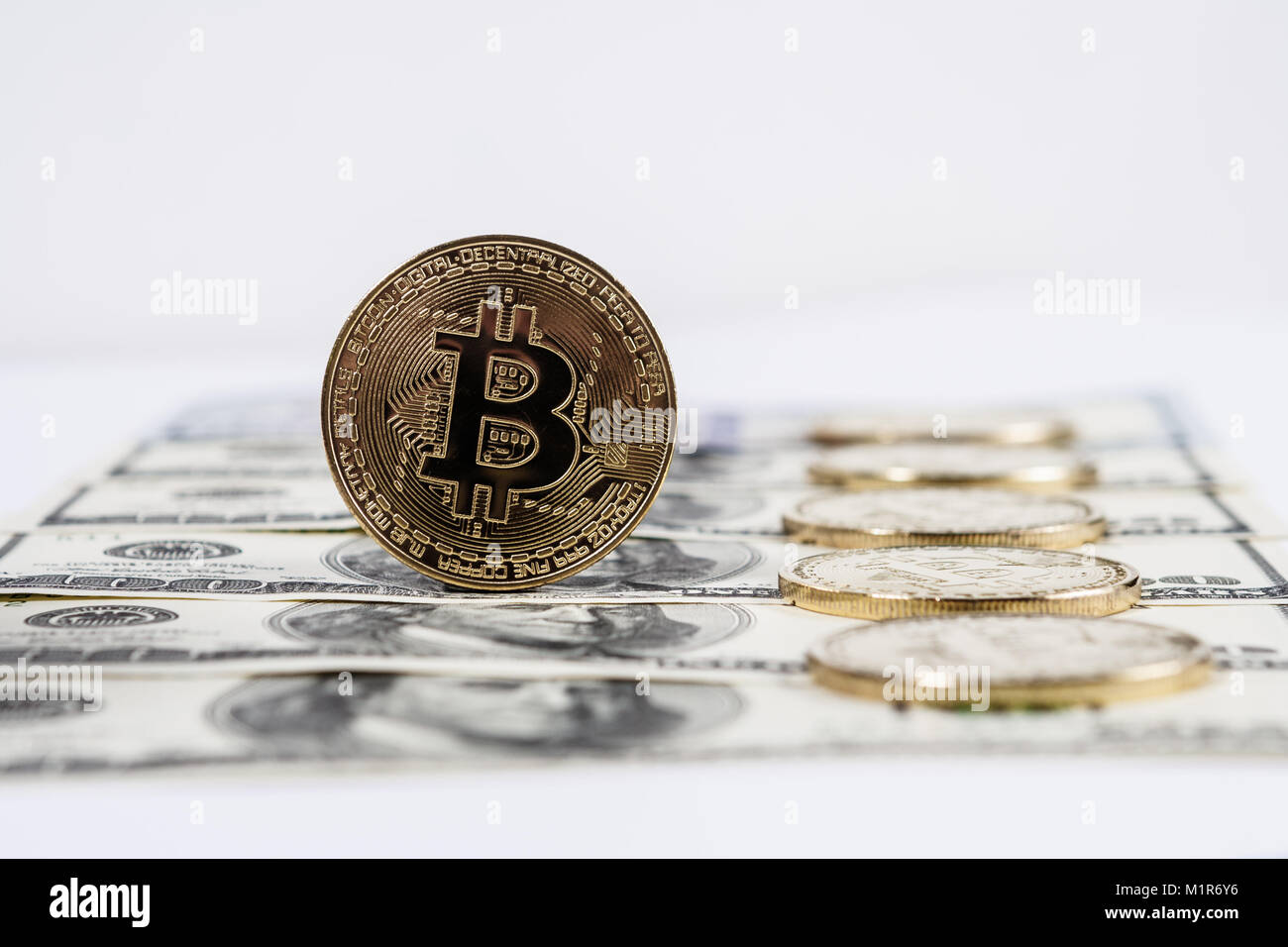 New virtual money Golden bitcoin coin on us dollars background ...