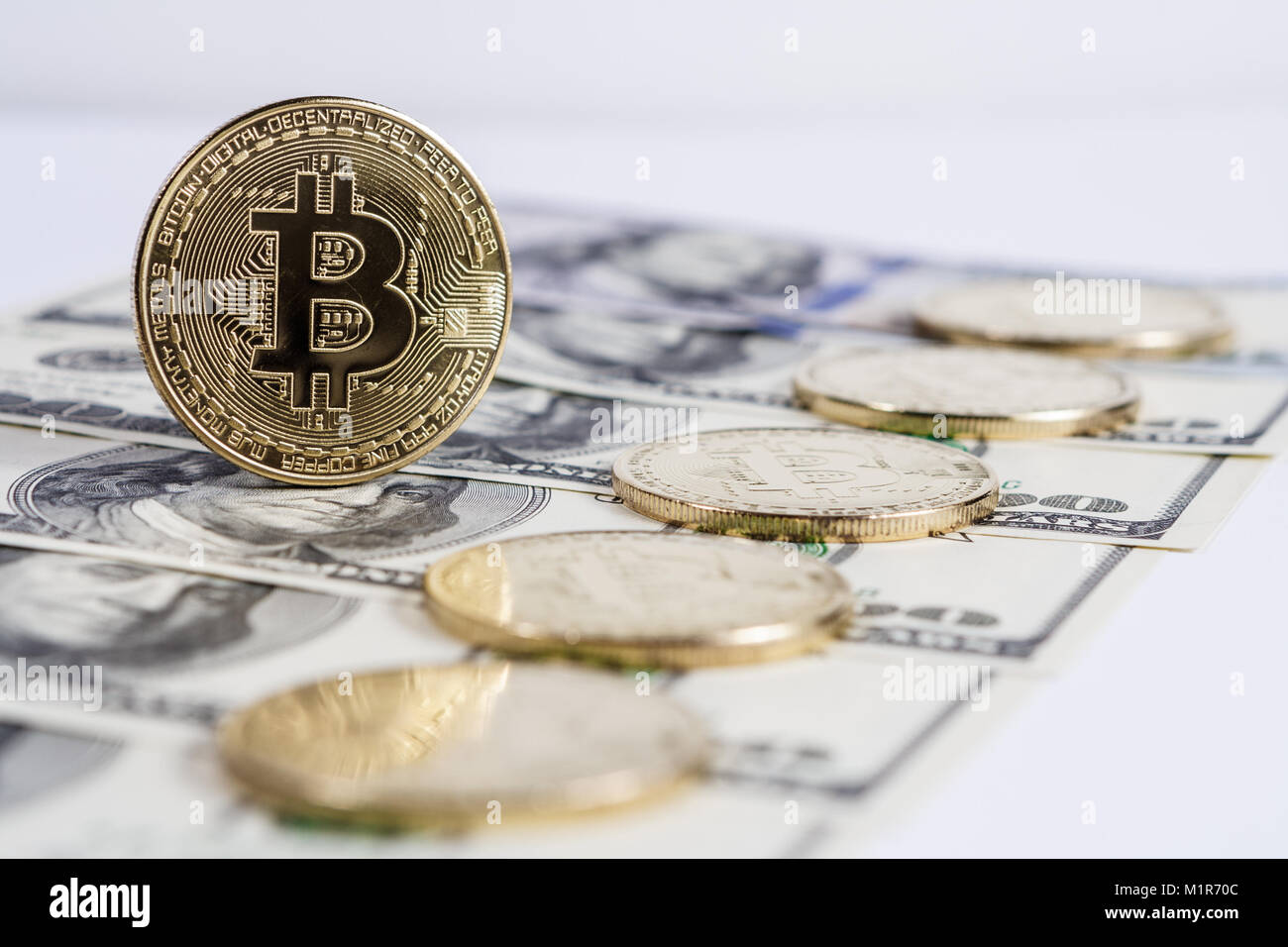 New virtual money Golden bitcoin coin on us dollars background ...
