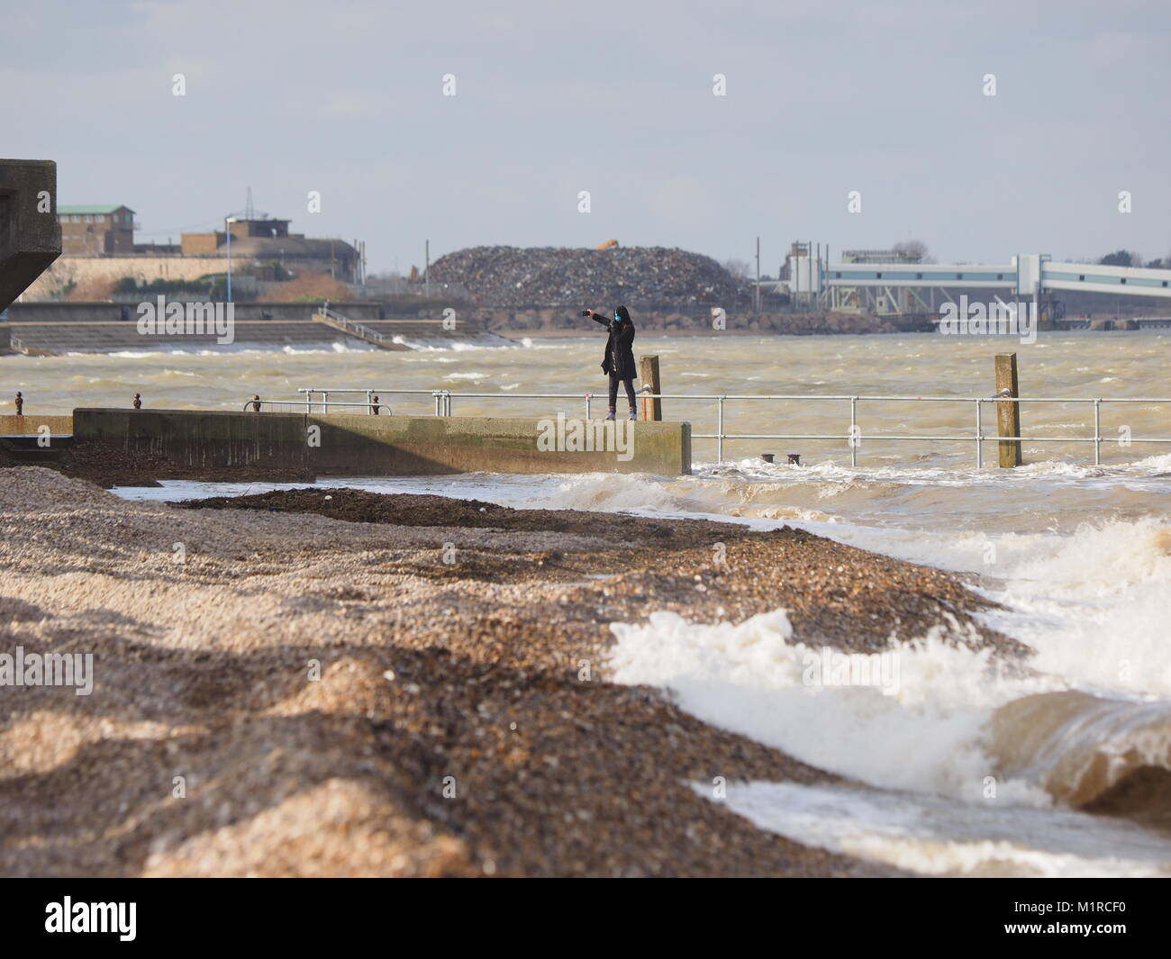 Sheerness, Kent, UK. 1st Feb, 2018. UK Weather: a young woman takes a ...