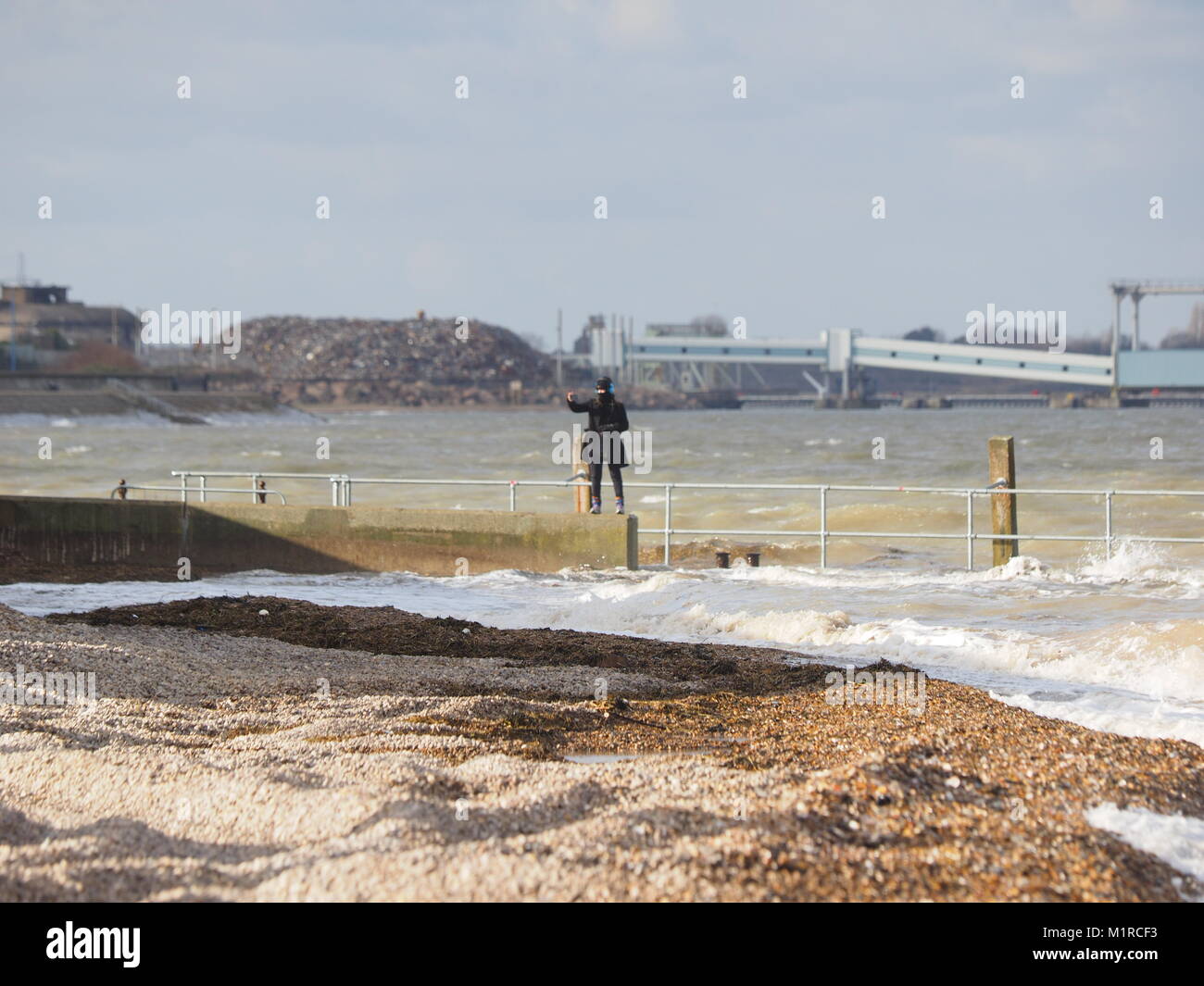 Sheerness, Kent, UK. 1st Feb, 2018. UK Weather: a young woman takes a ...