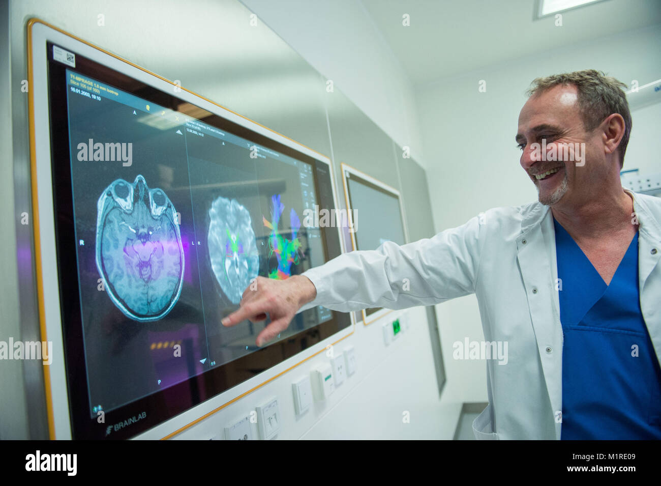Bernhard Meyer, director of the neurosurgery clinic, swipes a human ...