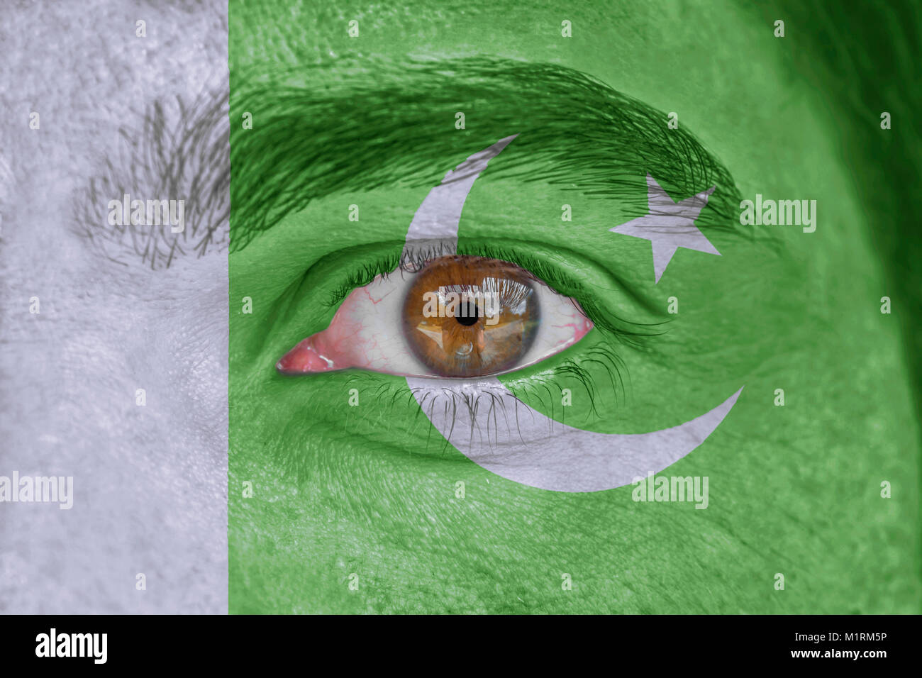 Human face and eye painted with flag of Pakistan Stock Photo - Alamy