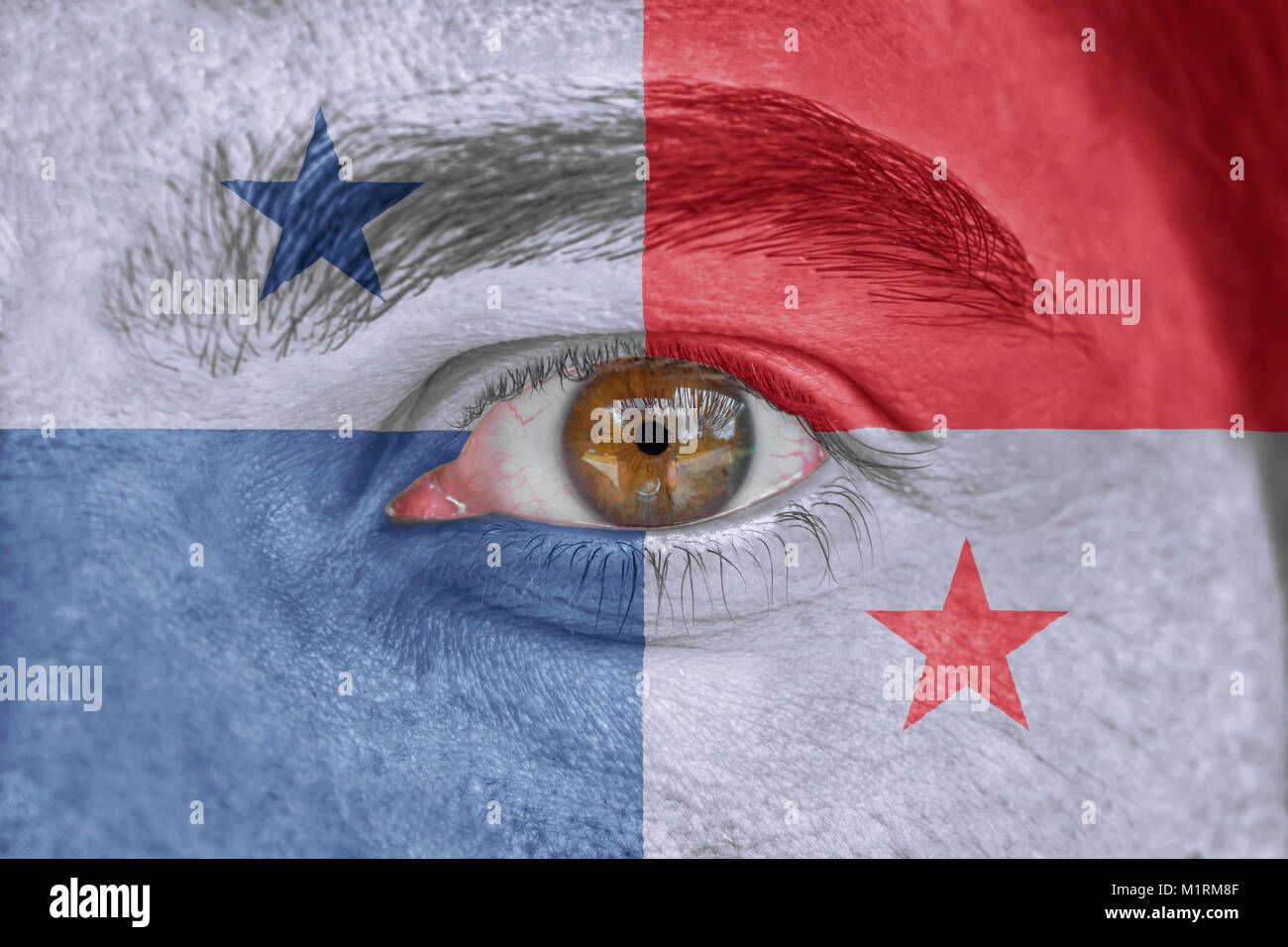 Human face and eye painted with flag of Panama Stock Photo - Alamy