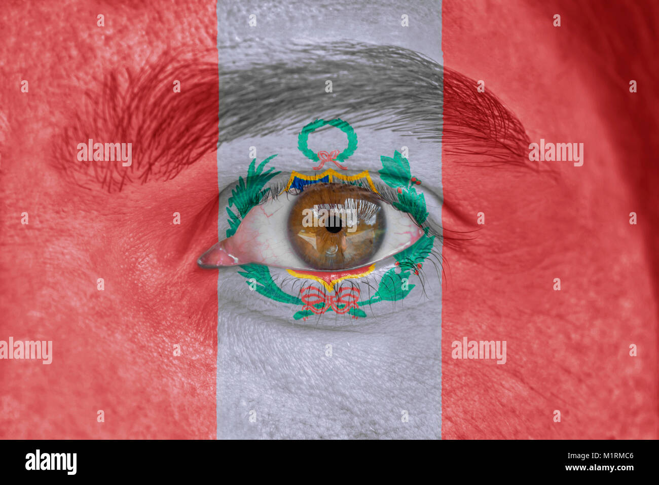 Human face and eye painted with flag of Peru Stock Photo - Alamy