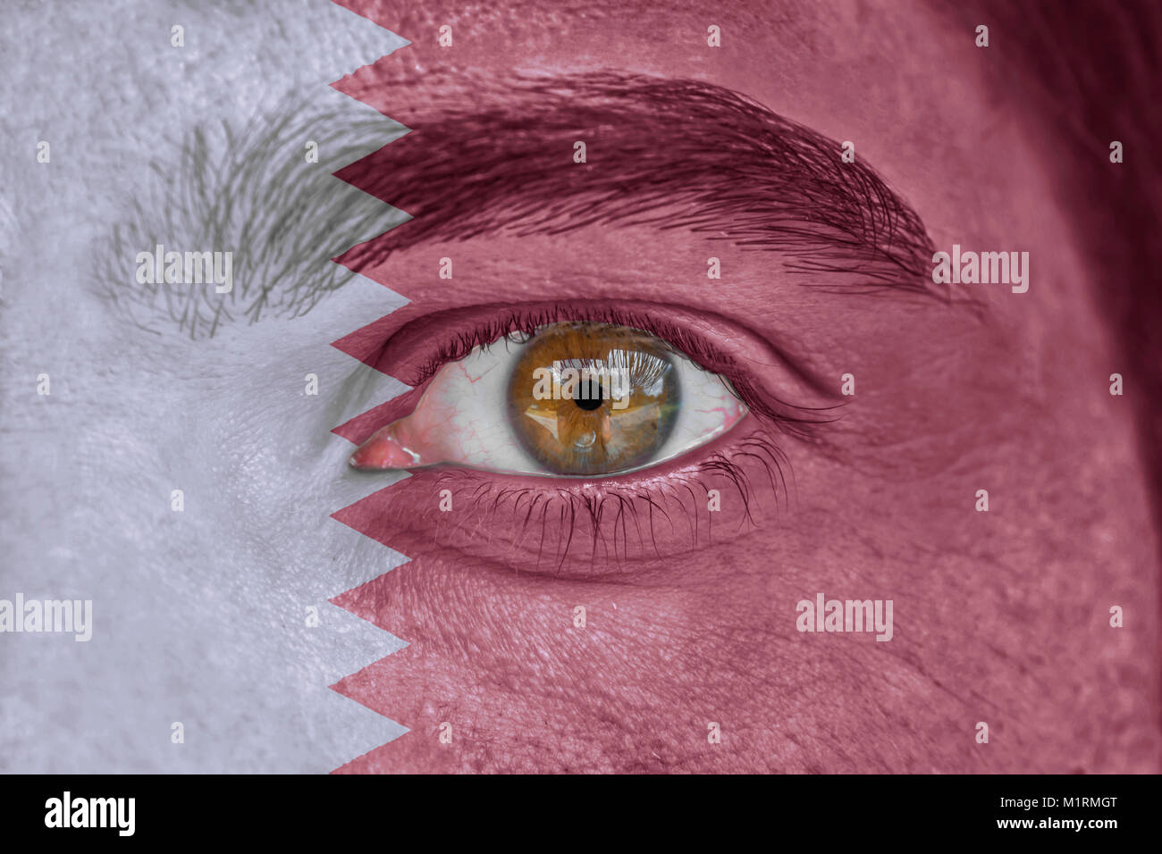 Human face and eye painted with flag of Qatar Stock Photo - Alamy