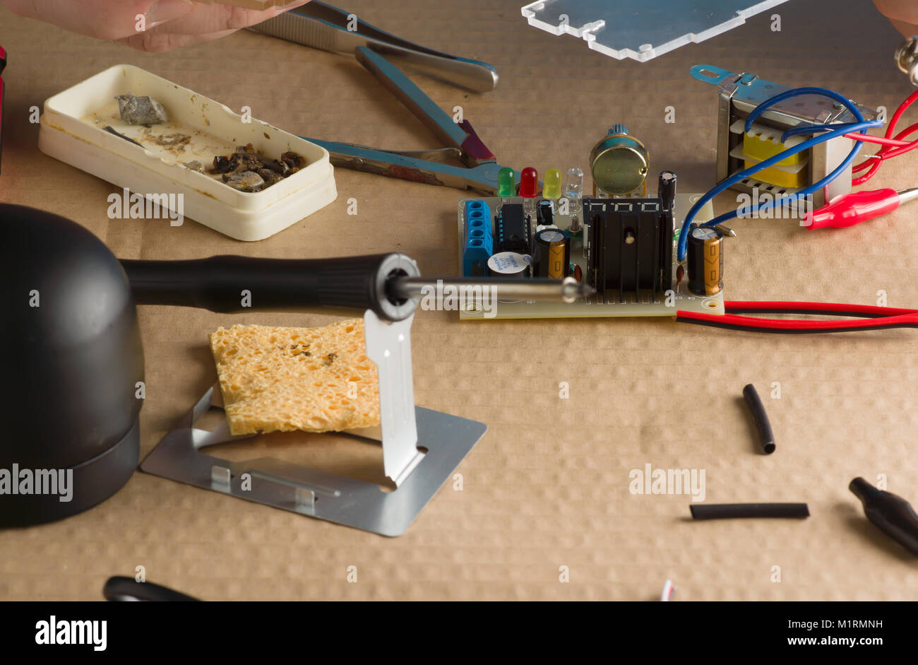 master repairs electronic equipment at his workplace Stock Photo - Alamy