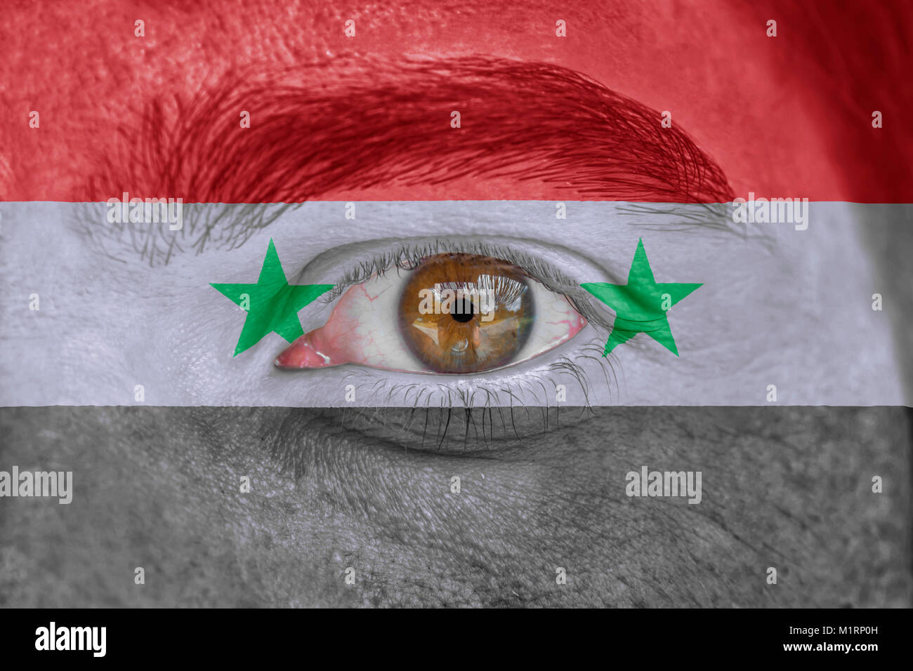 Human face and eye painted with flag of Syria Stock Photo - Alamy